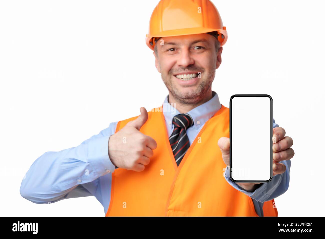 Construction Worker Showing Smartphone Empty Screen Gesturing Thumbs-Up ...