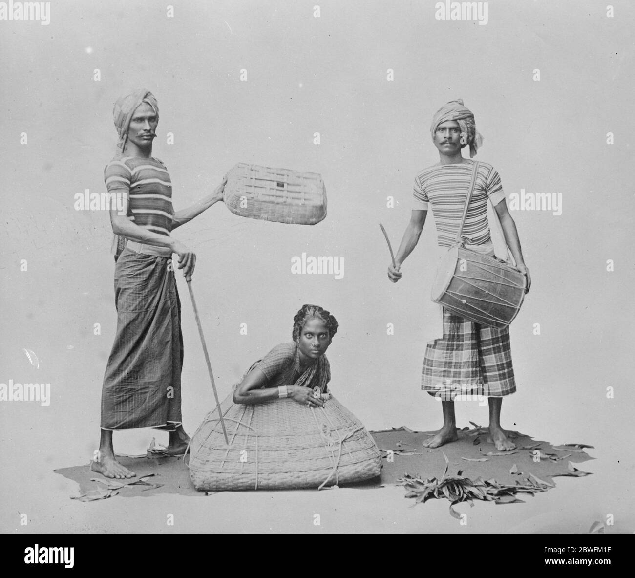 Indian types . An Indian juggler performing the famous basket trick ...