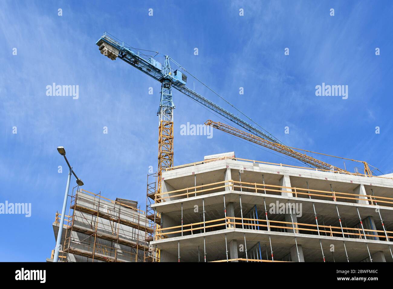 Tower crane at the construction of an apartment building Stock Photo ...
