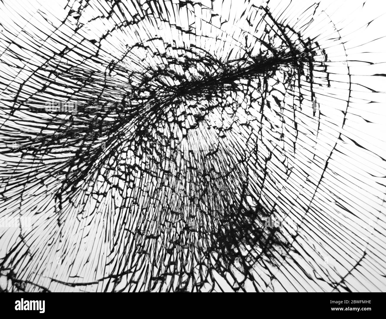 Many small cracks on the glass from the impact, broken car windshield ...