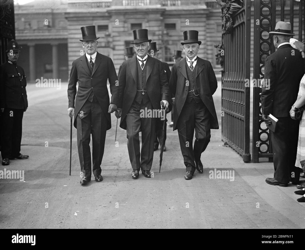 Investiture at Buckingham Palace . Left to right : Sir Colville Smith ...