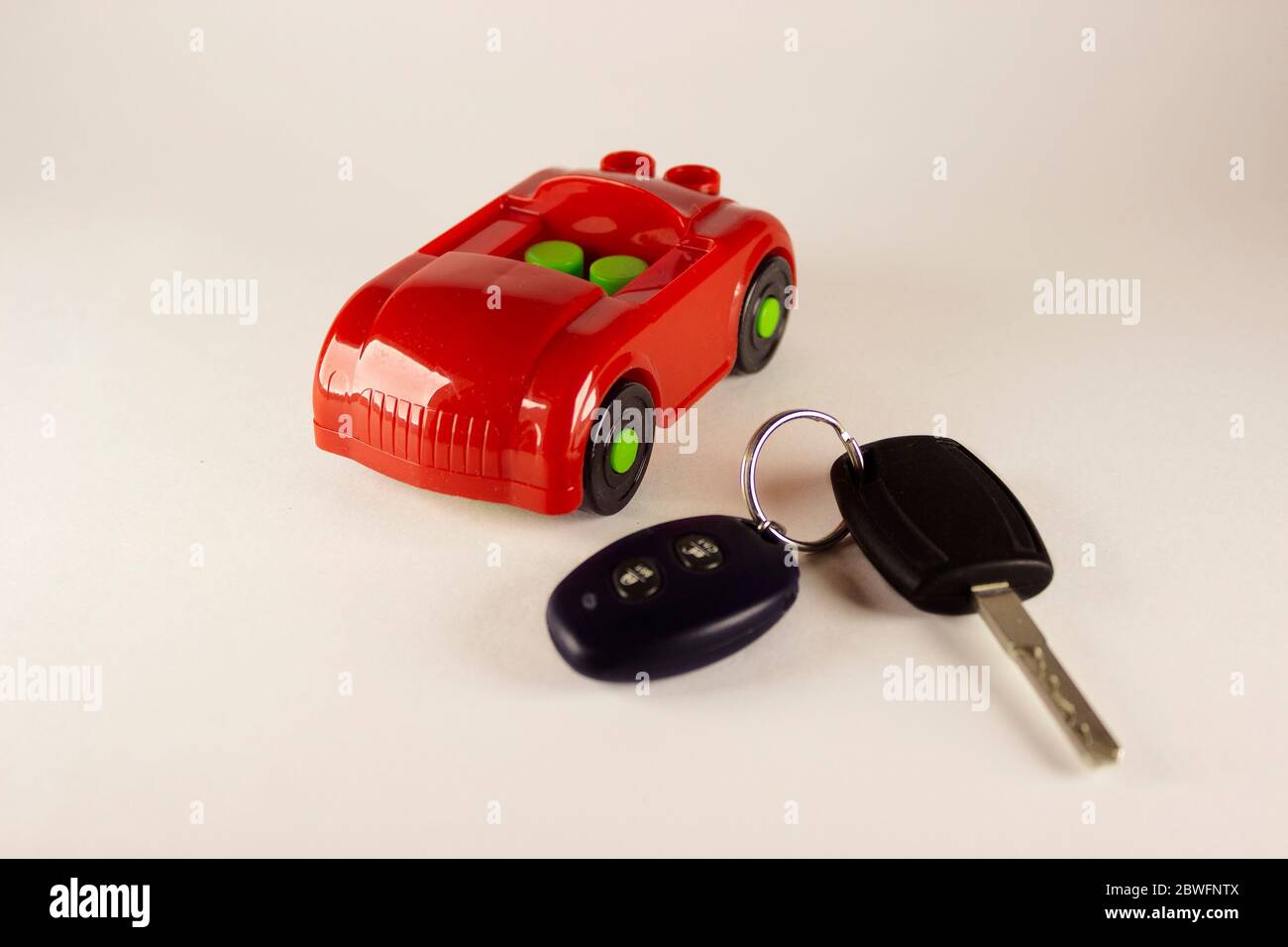 Car Key, Red Toy Car On White background. Toy car with a keys on white ...