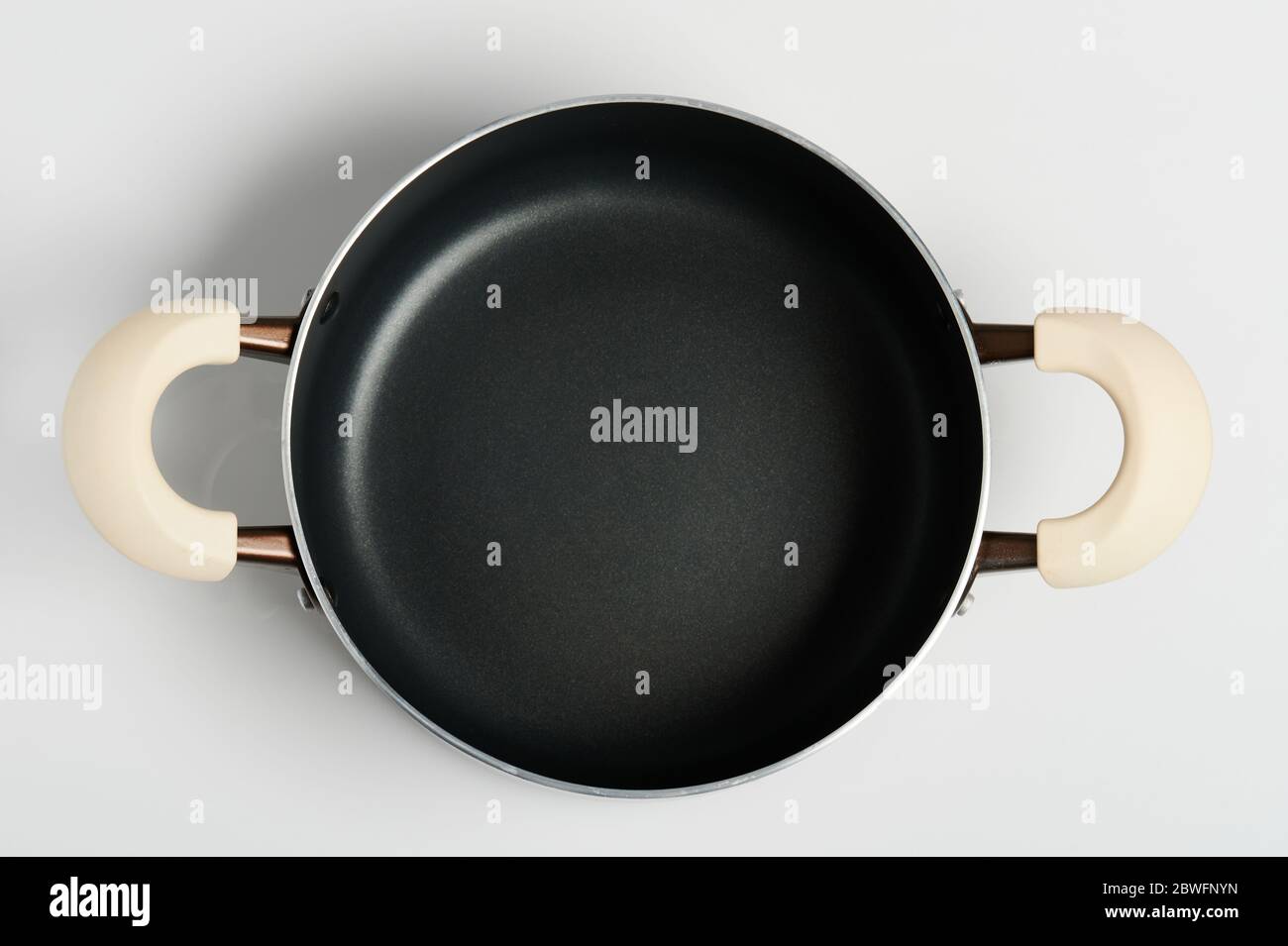 Black metal new cooking pot above top view isolated Stock Photo - Alamy