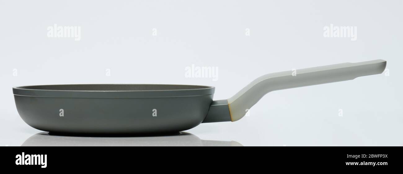 Gray fry pan side view isolated on white background Stock Photo - Alamy