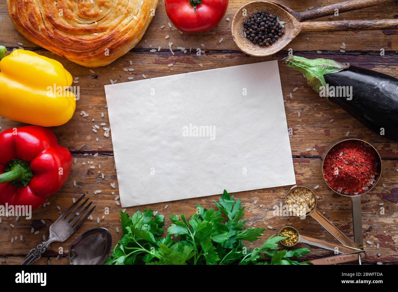 Pilaf ingredients on rustic surface with space for your recipe on paper ...