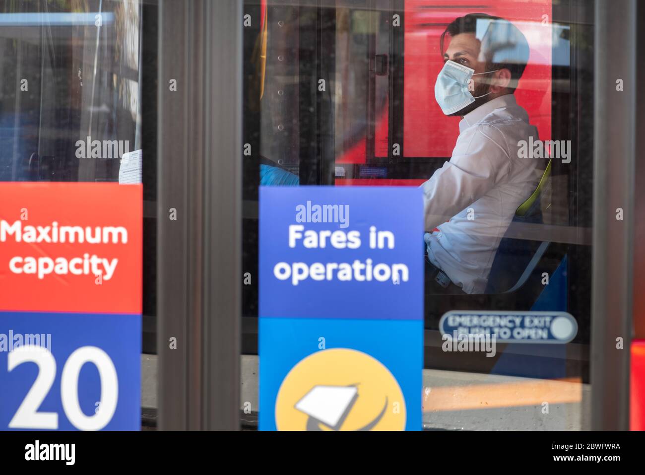 New stickers on buses remind commuters to socially distance during the ...