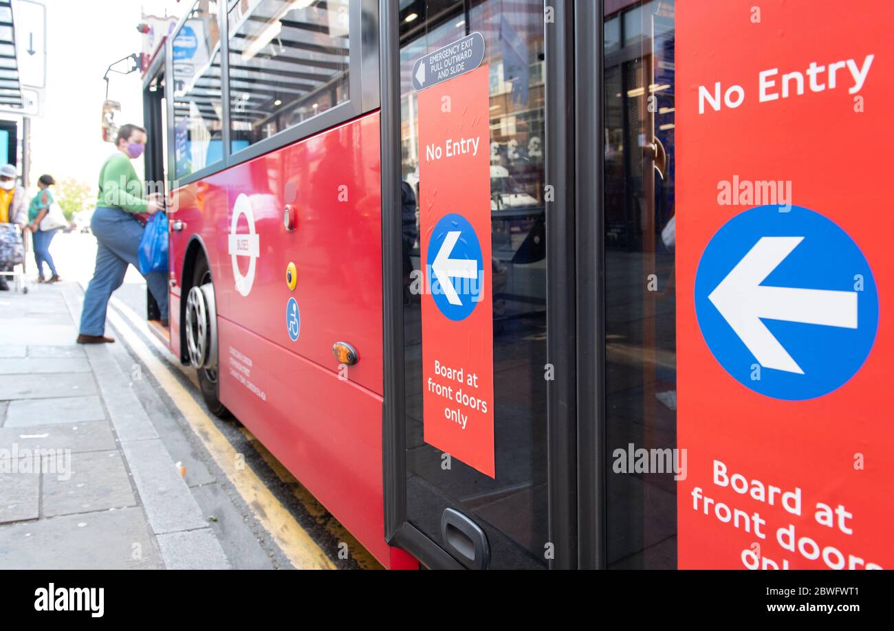 New stickers on buses remind commuters to socially distance during the ...