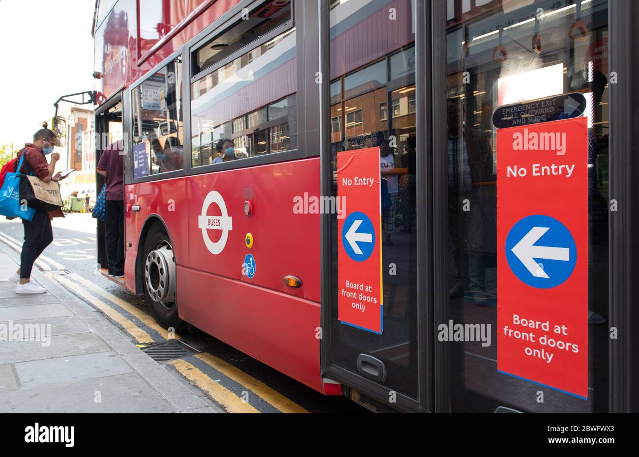 New stickers on buses remind commuters to socially distance during the ...