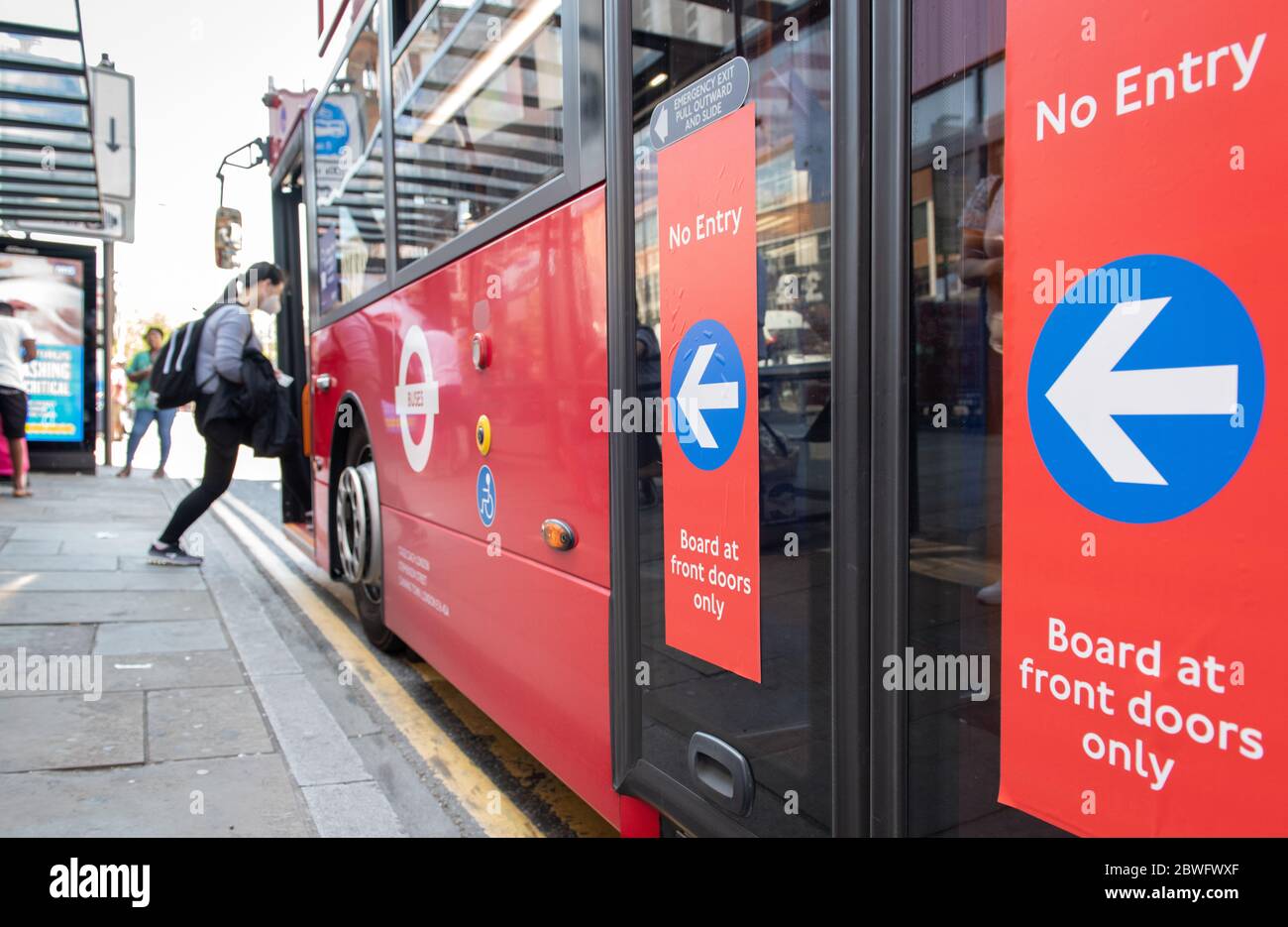 New stickers on buses remind commuters to socially distance during the ...