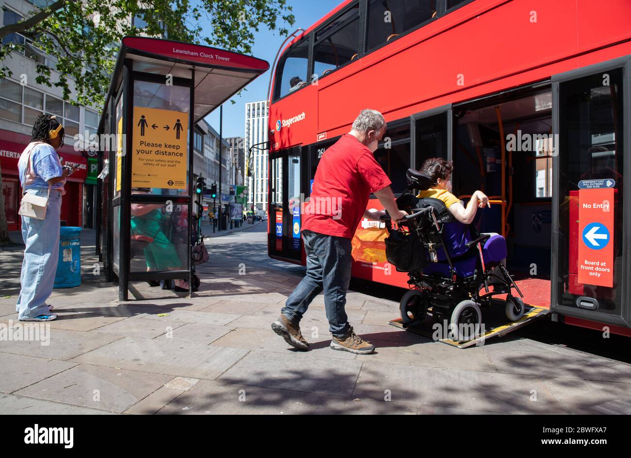 New stickers on buses remind commuters to socially distance during the ...