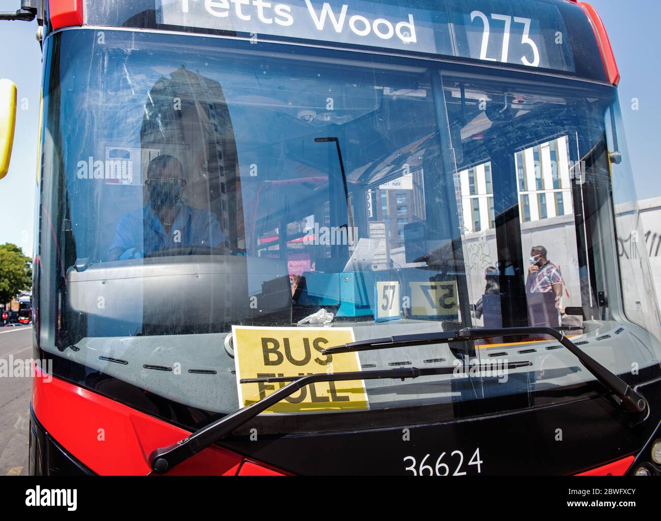 New stickers on buses remind commuters to socially distance during the ...