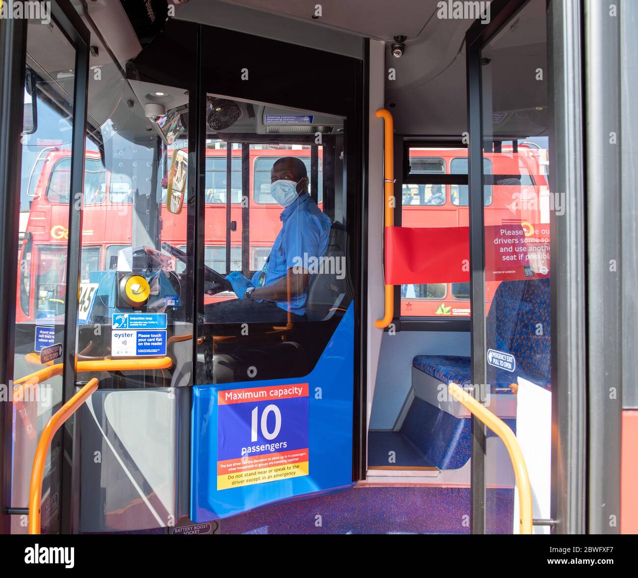 New stickers on buses remind commuters to socially distance during the ...