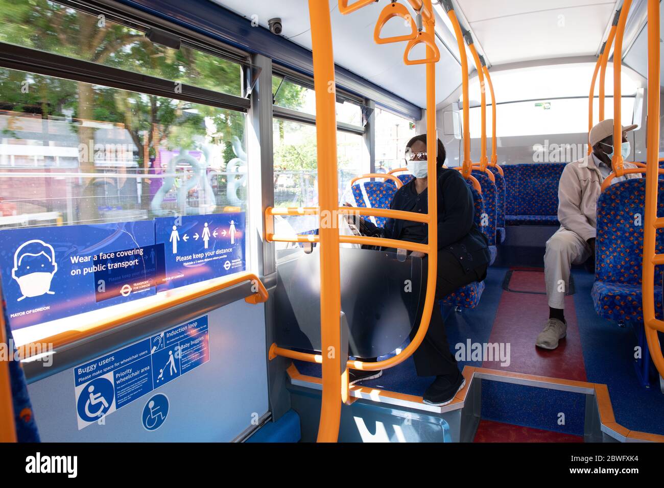 New stickers on buses remind commuters to socially distance during the ...