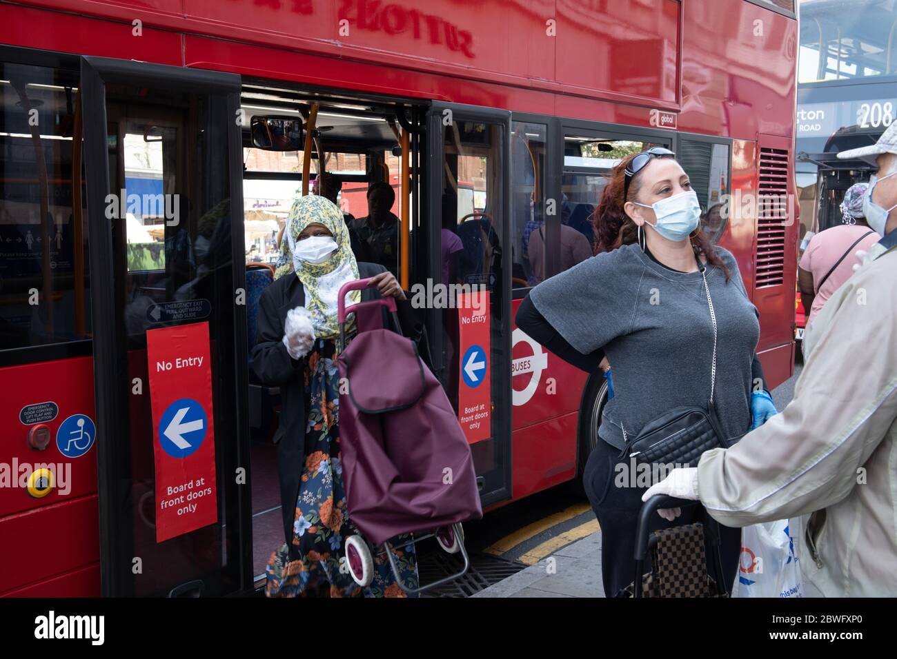 New stickers on buses remind commuters to socially distance during the ...
