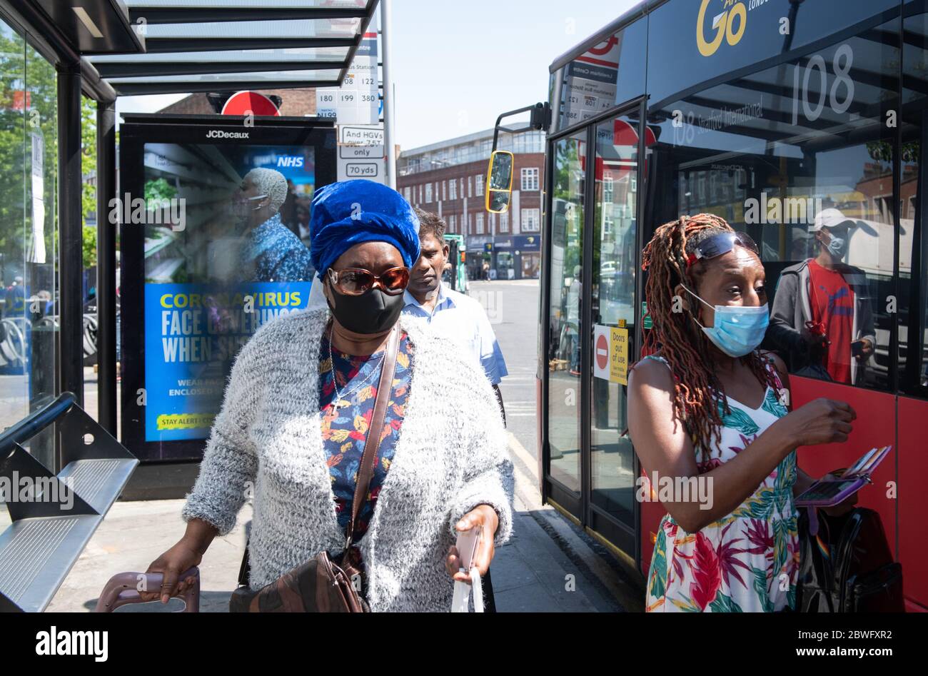 New stickers on buses remind commuters to socially distance during the ...