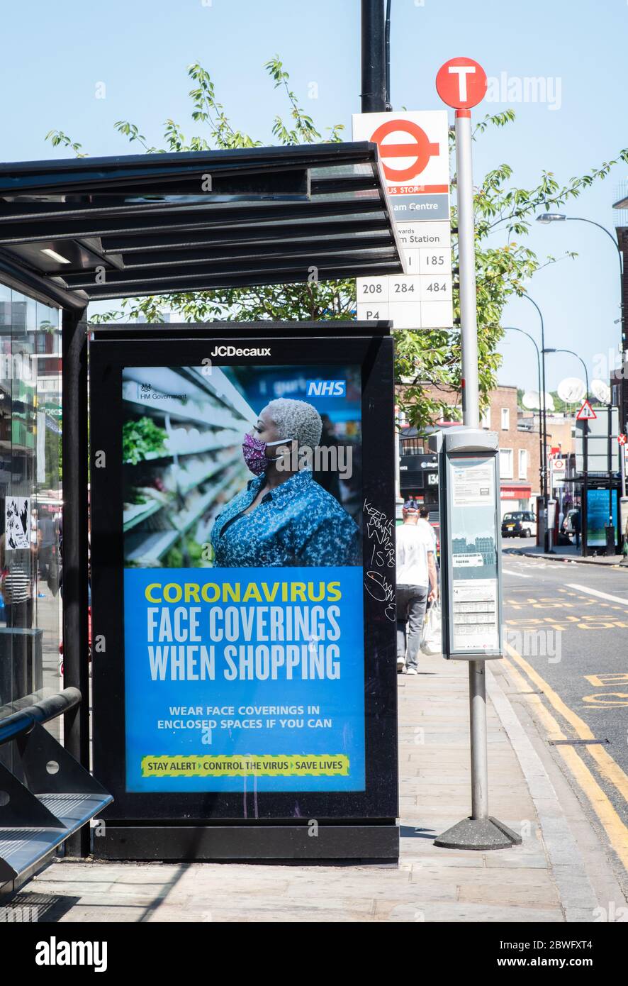 New stickers on buses remind commuters to socially distance during the ...