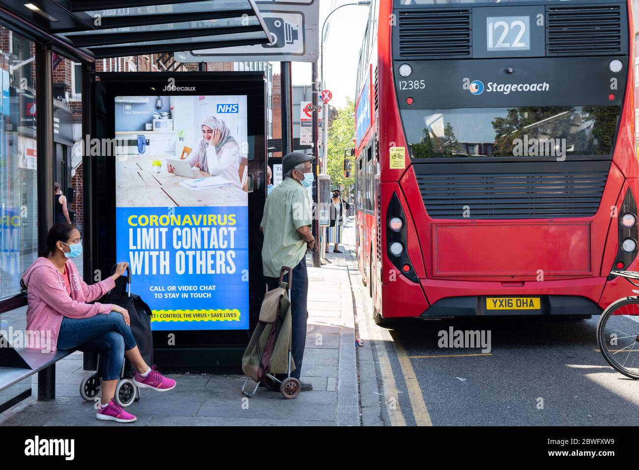 New stickers on buses remind commuters to socially distance during the ...