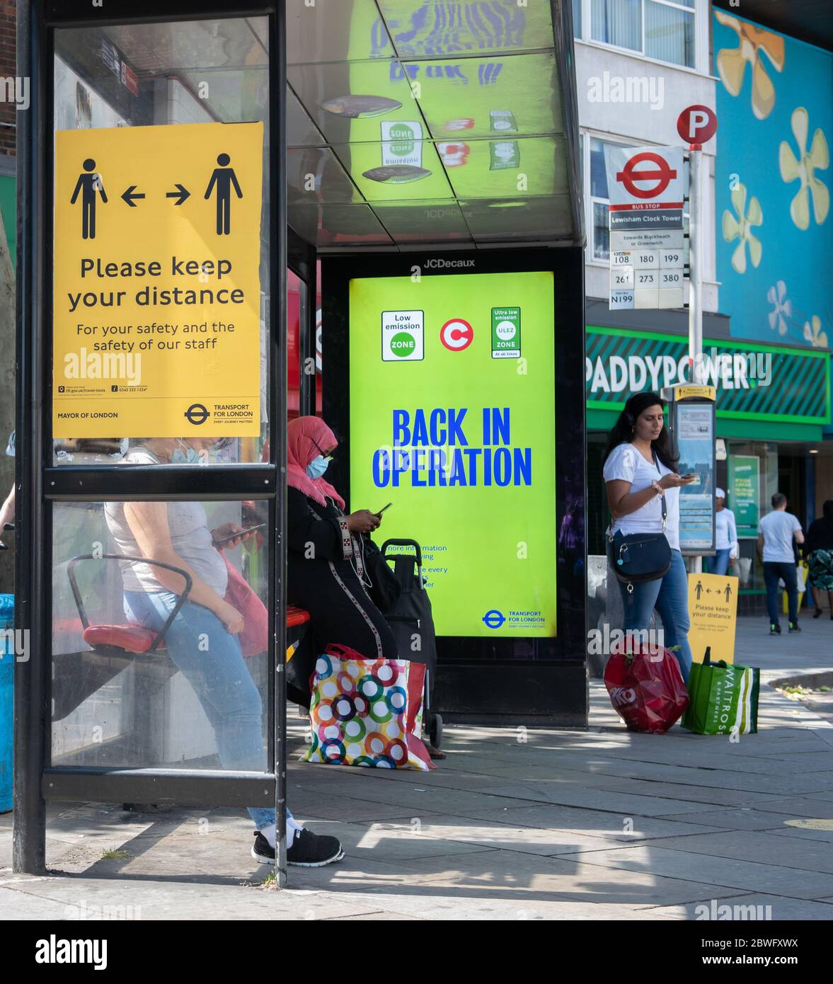 New stickers on buses remind commuters to socially distance during the ...
