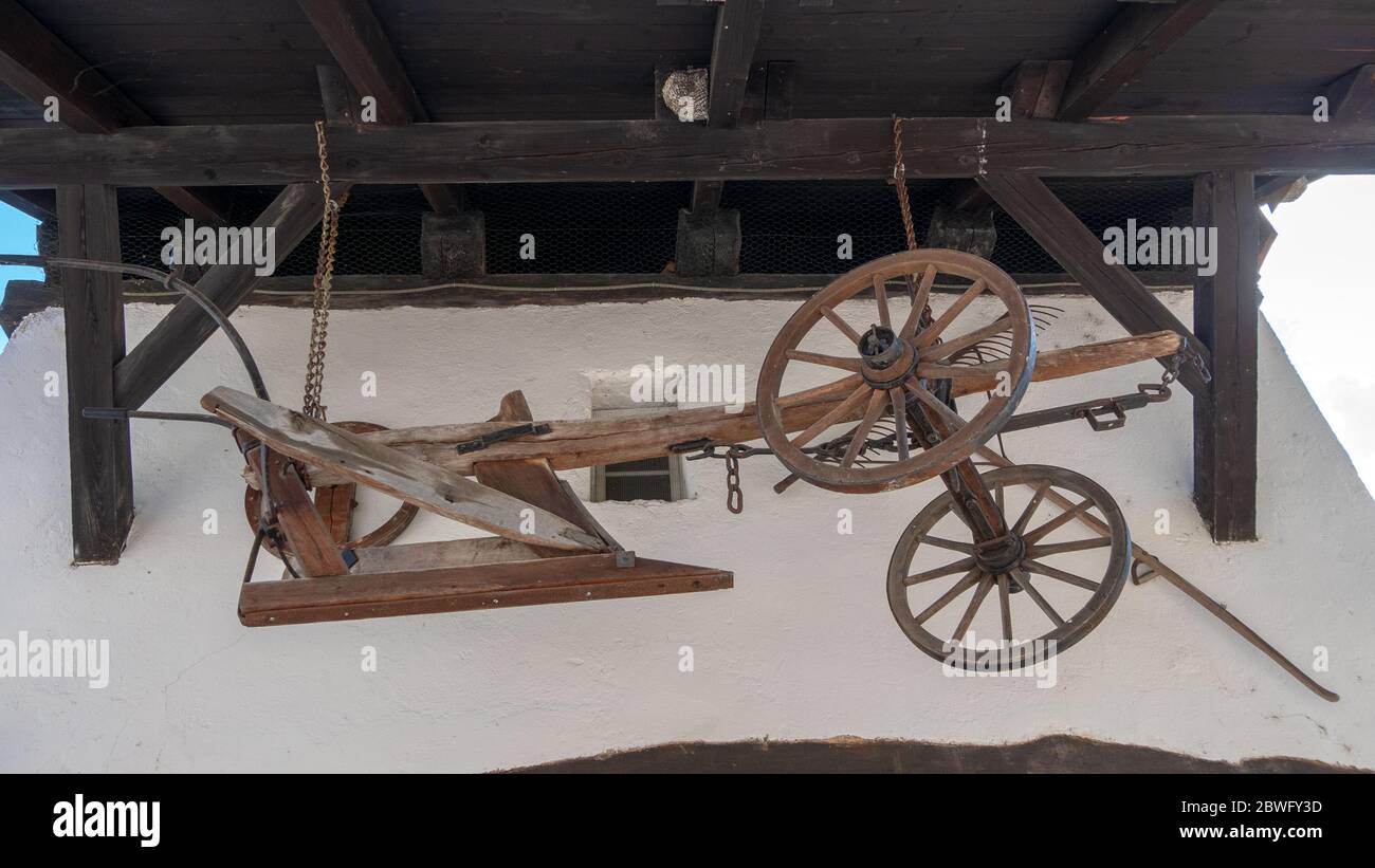 Old plow on chains under the roof Stock Photo - Alamy