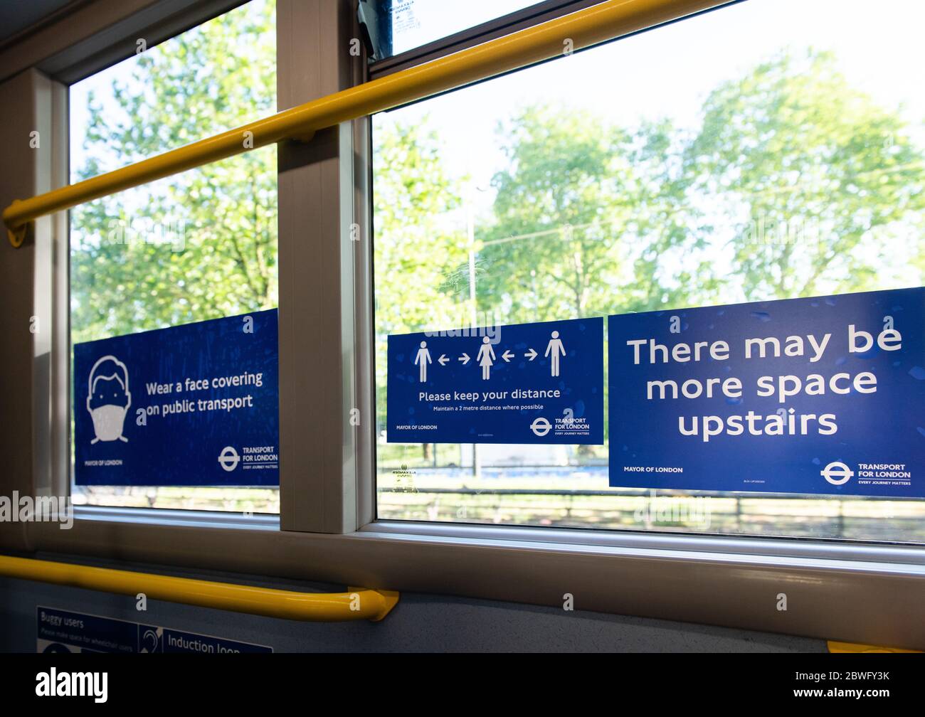 New stickers on buses remind commuters to socially distance during the ...