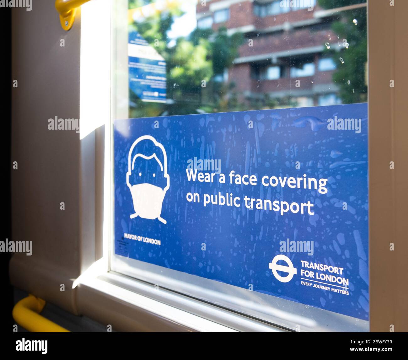 New stickers on buses remind commuters to socially distance during the ...