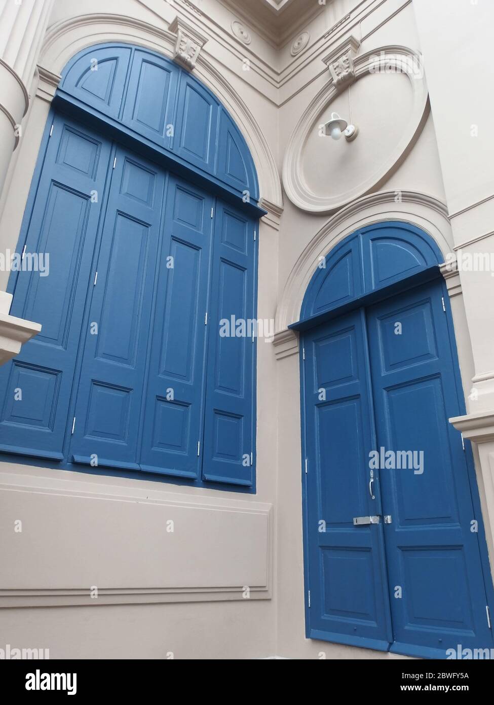 Large wooden window doors, neoclassical architecture Stock Photo - Alamy