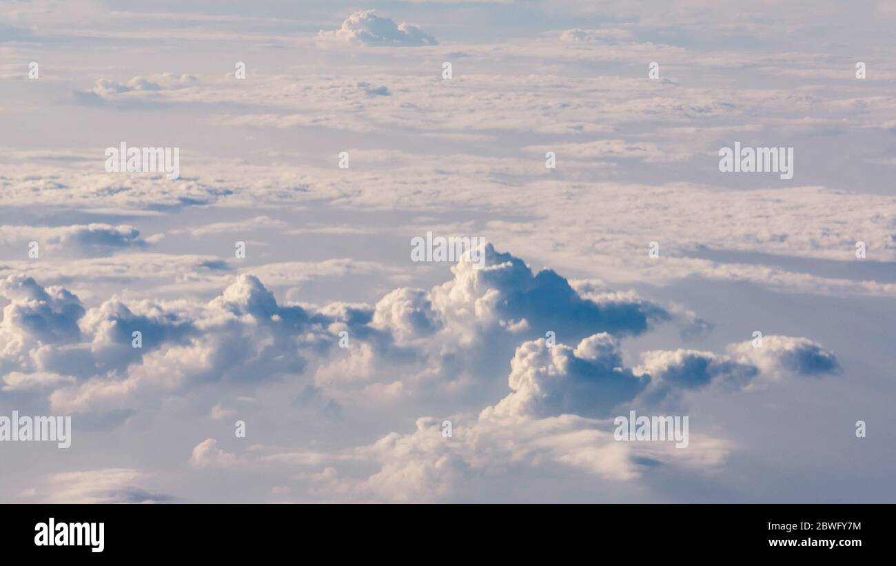White cumulus clouds on clear blue sky background closeup Stock Photo ...