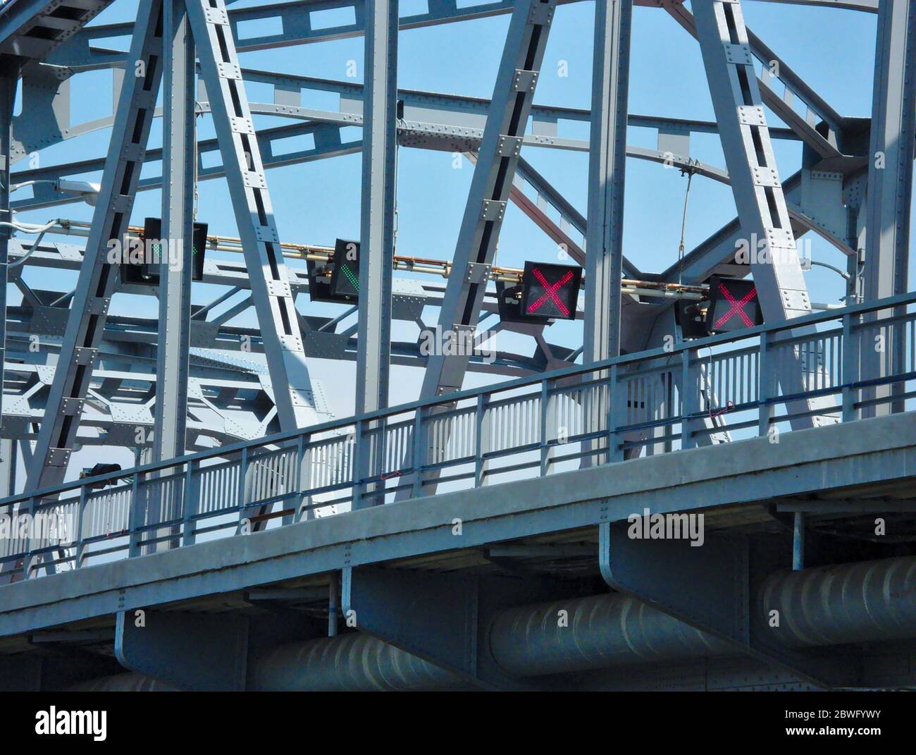 Iron bridges across the river and traffic lights, red green arrows on ...