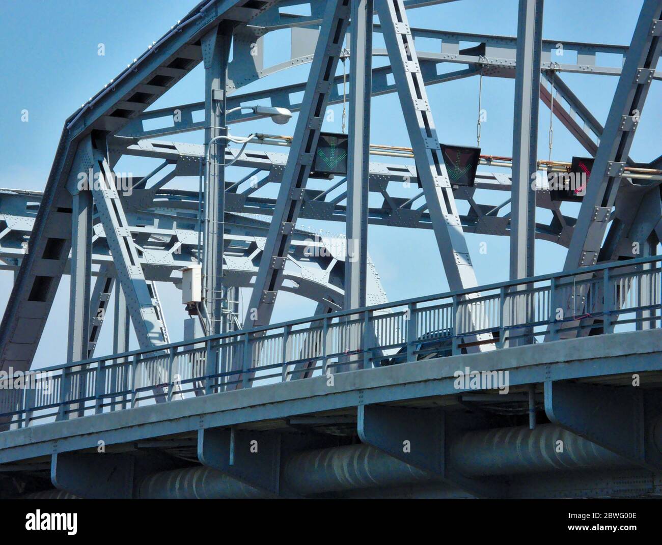 Iron bridges across the river and traffic lights, red green arrows on ...