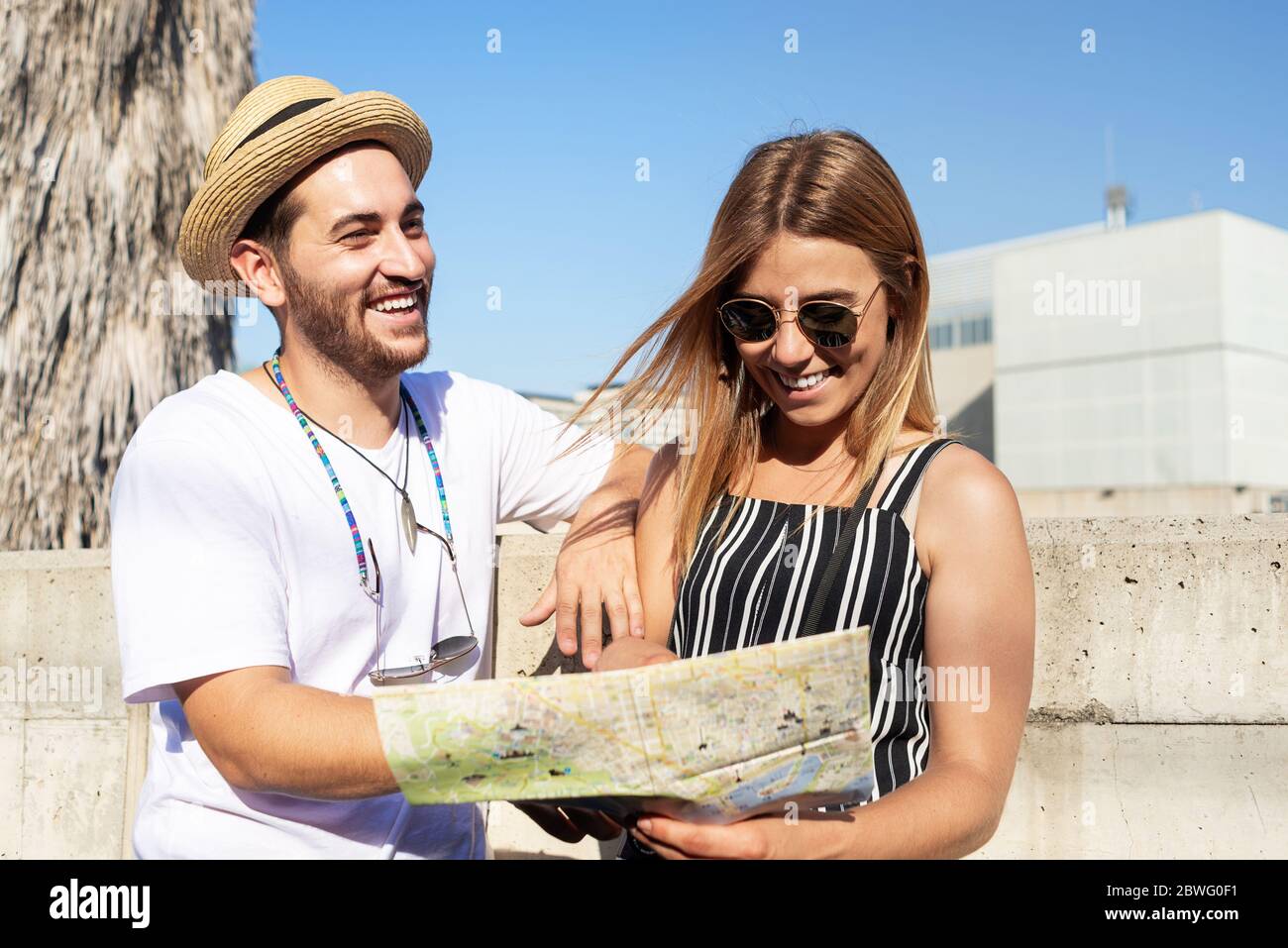 Female tourist checking map hi-res stock photography and images - Alamy