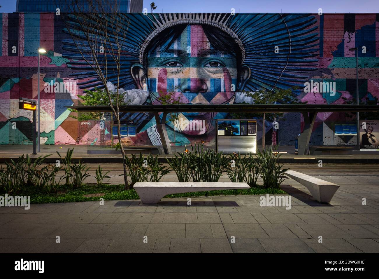 View to big grafitti mural with giant street art faces in downtown area ...