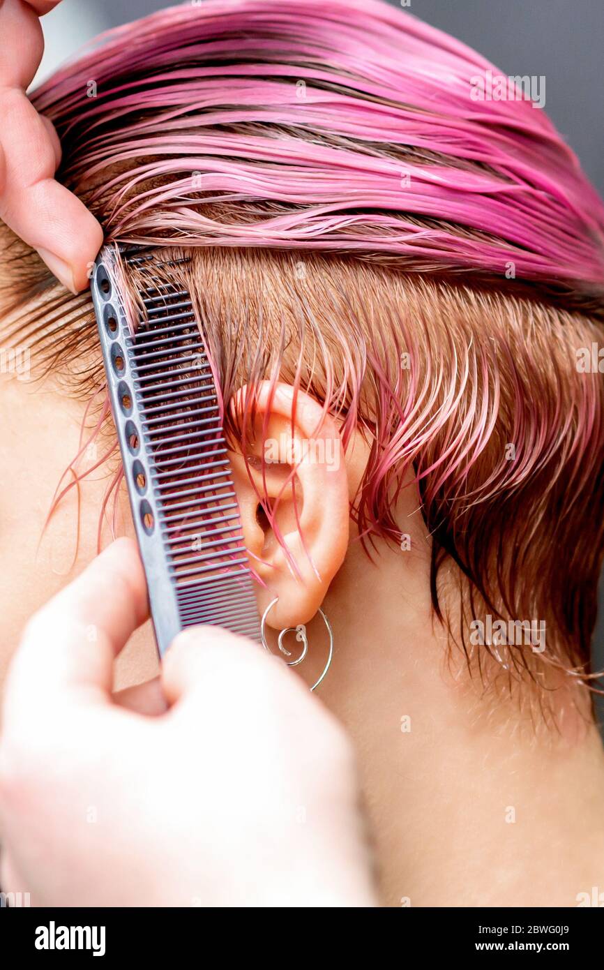 Woman combing hair fingers hi-res stock photography and images - Alamy