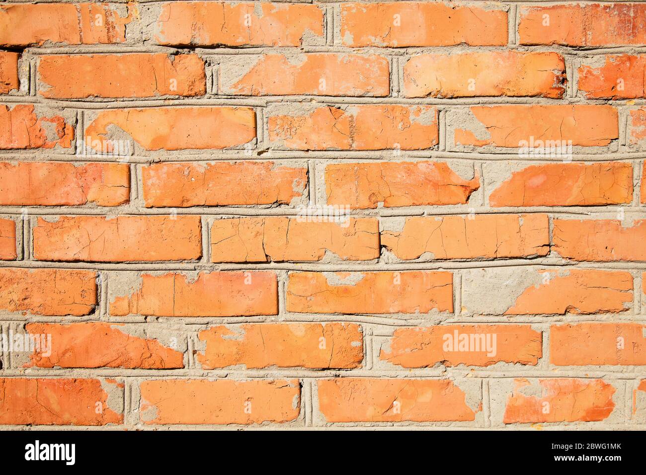 Weathered stained old brick wall background. Orange bricks Stock Photo ...