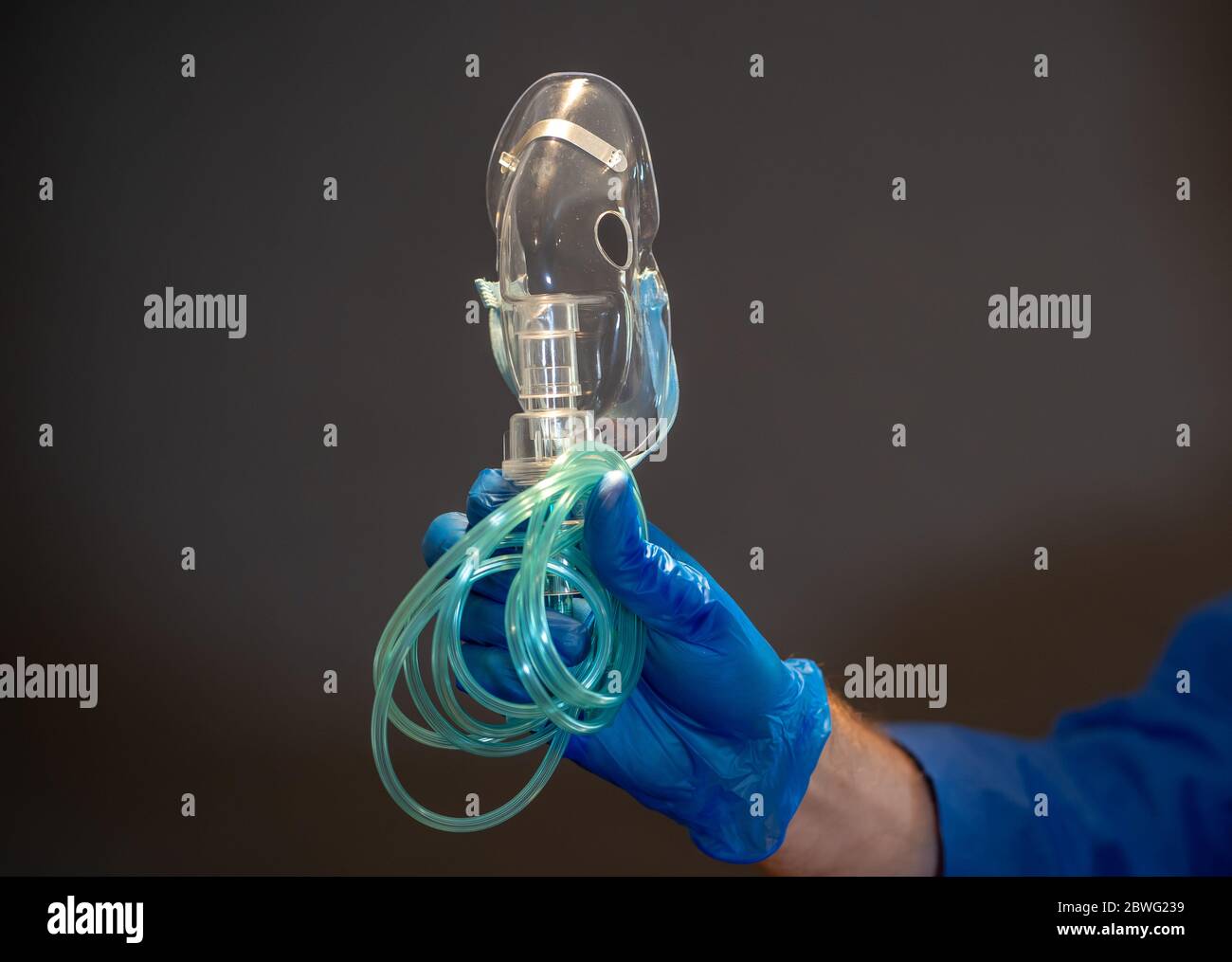 COVID-19 Outbreak. Exhausted Doctor holding non- invasive ventilator ...