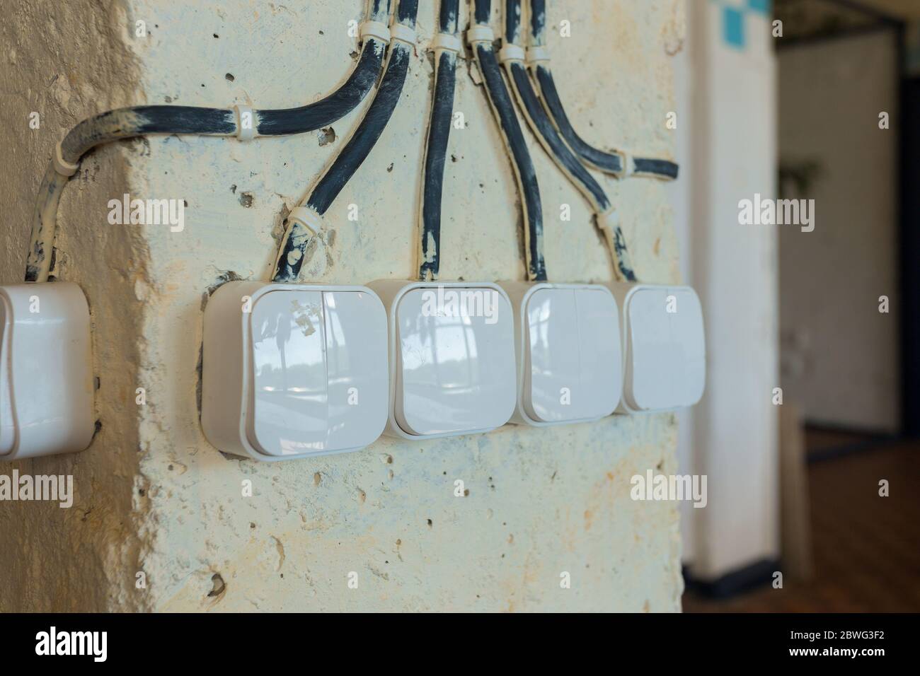external wiring of black wires in a column for light switches in an ...