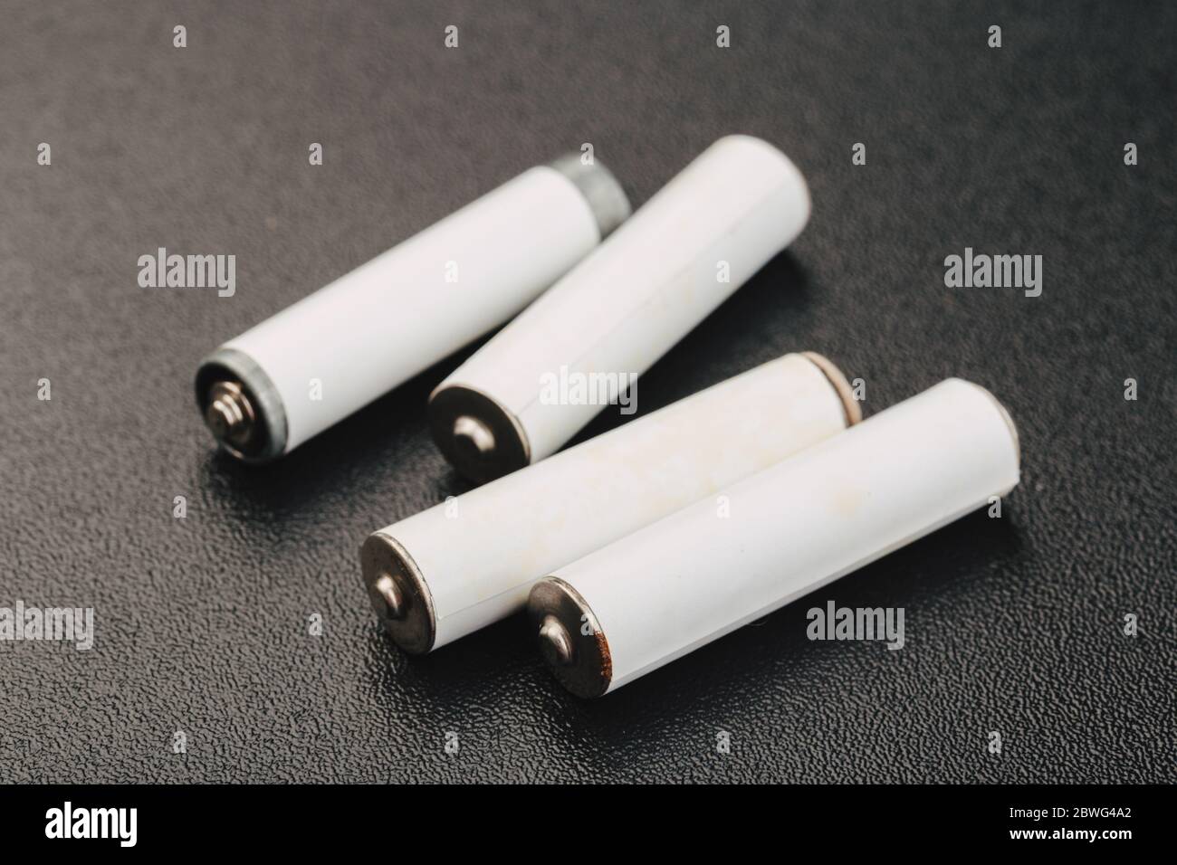 close up of battery positive poles on black backgrounds. intended ...