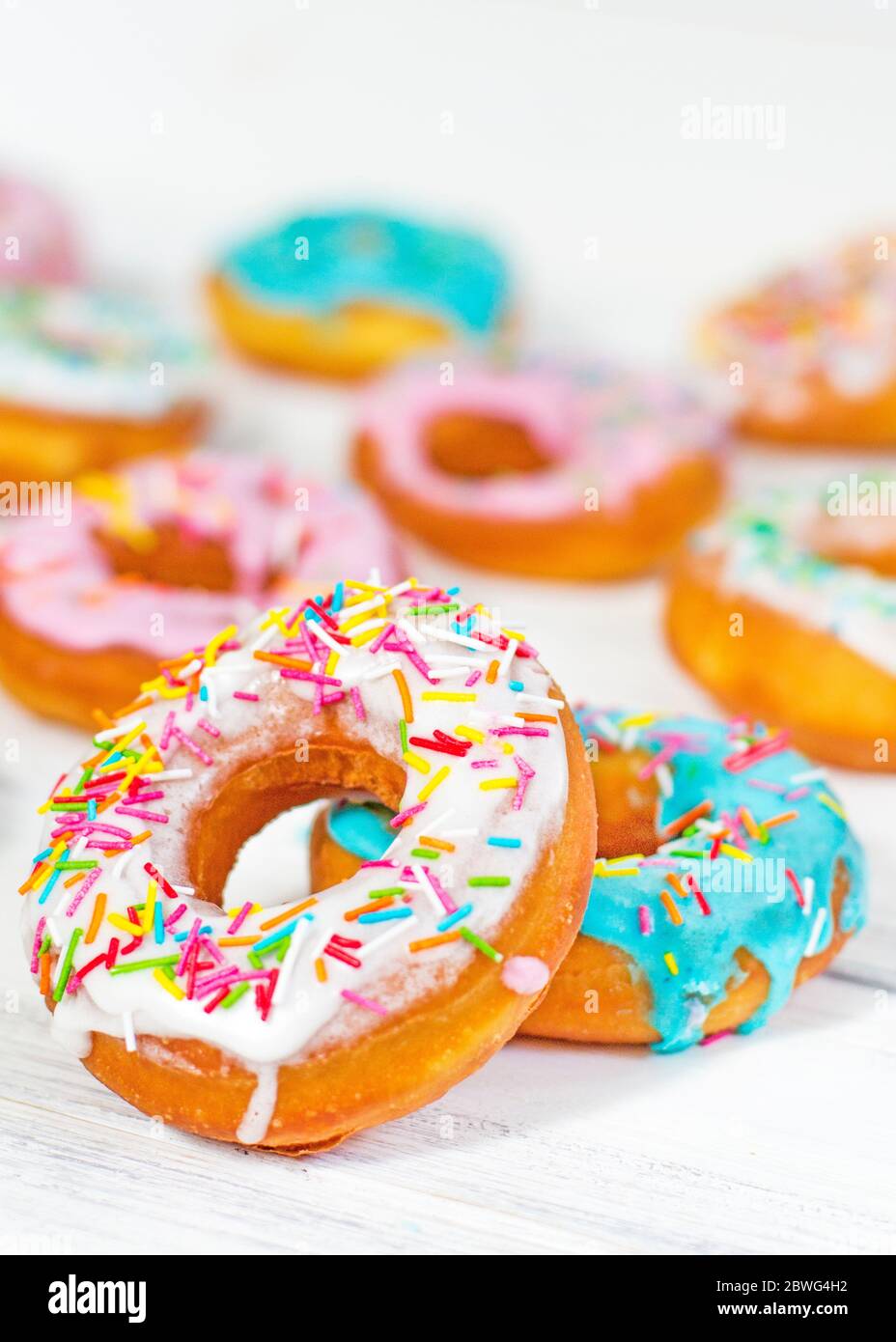 Colorful Donuts turquoise and pink on White Background close-up ...