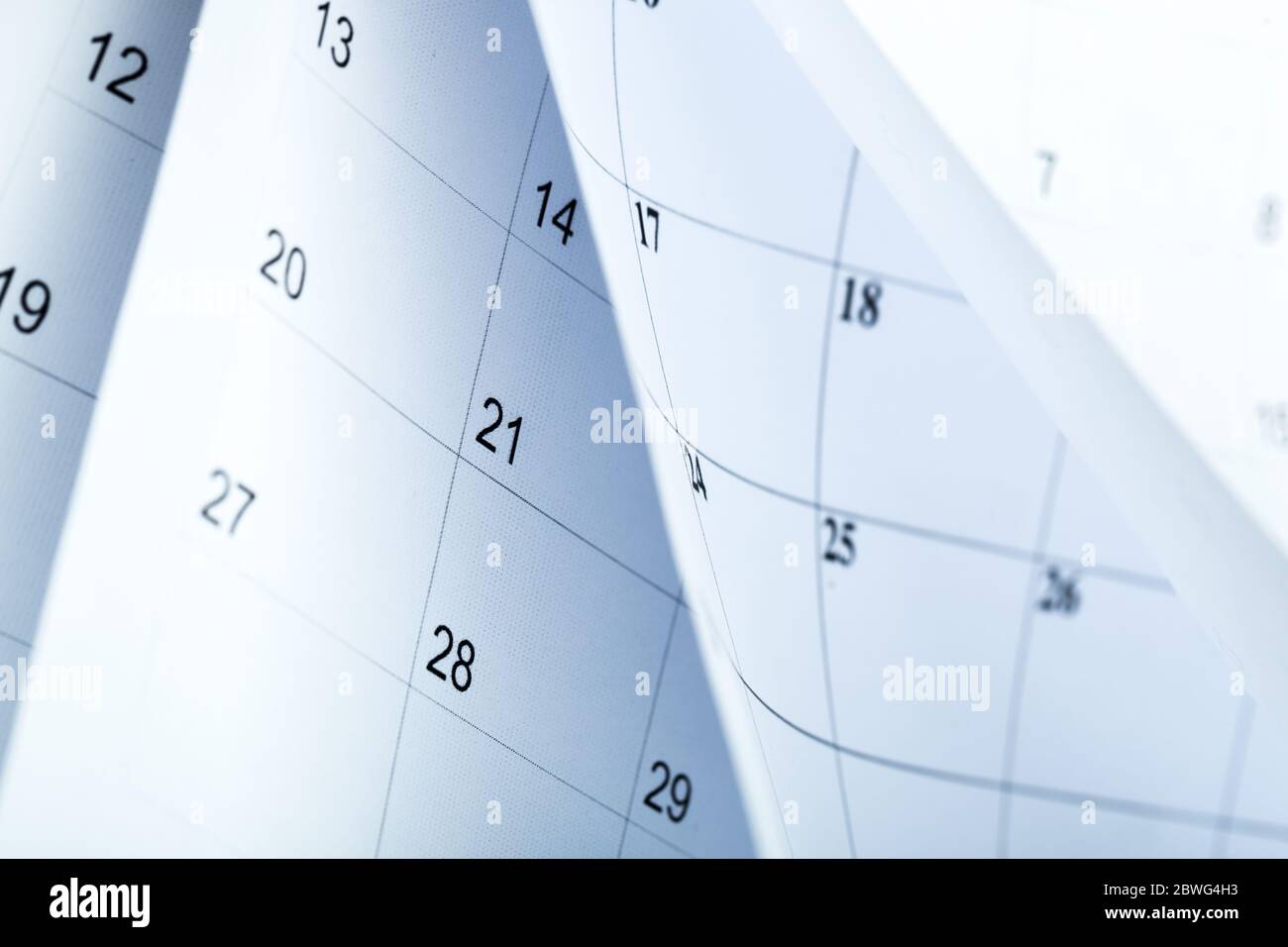 Closes a calendar page in blue. flipping calendar 2020 Stock Photo - Alamy