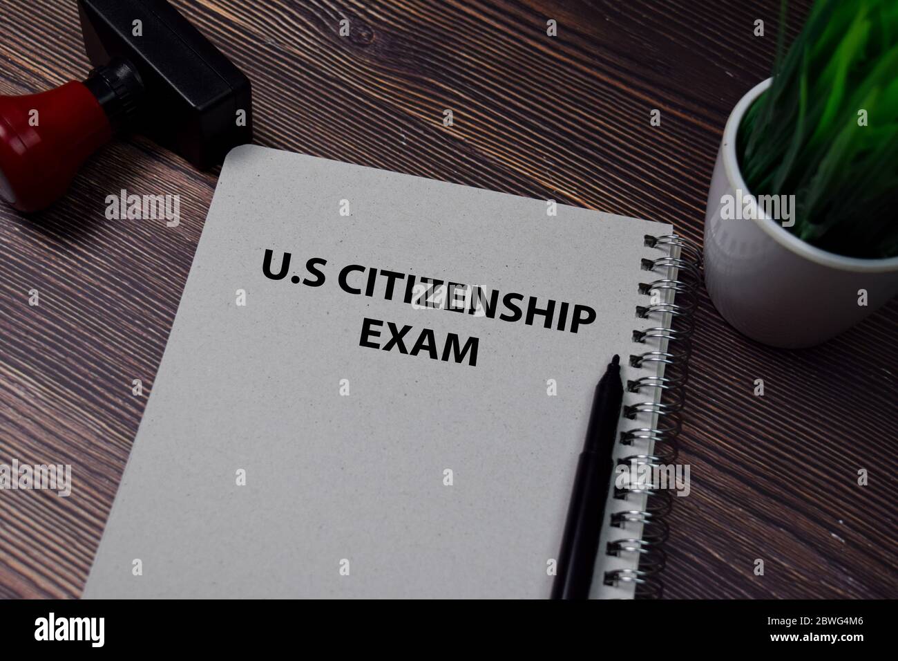 Book about U.S Citizenship Exam isolated on wooden table Stock Photo ...