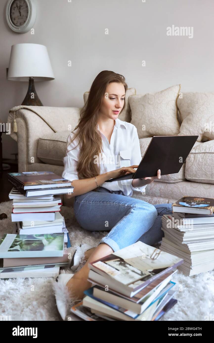 Young student watching lesson online and studying from home. Girl ...