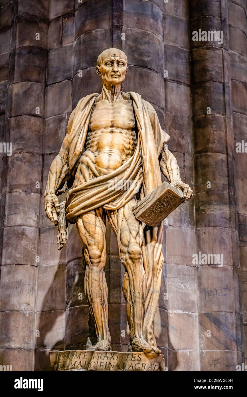 Milan, Lombardy, Italy - April 2019: Statue of St. Bartholomew inside ...