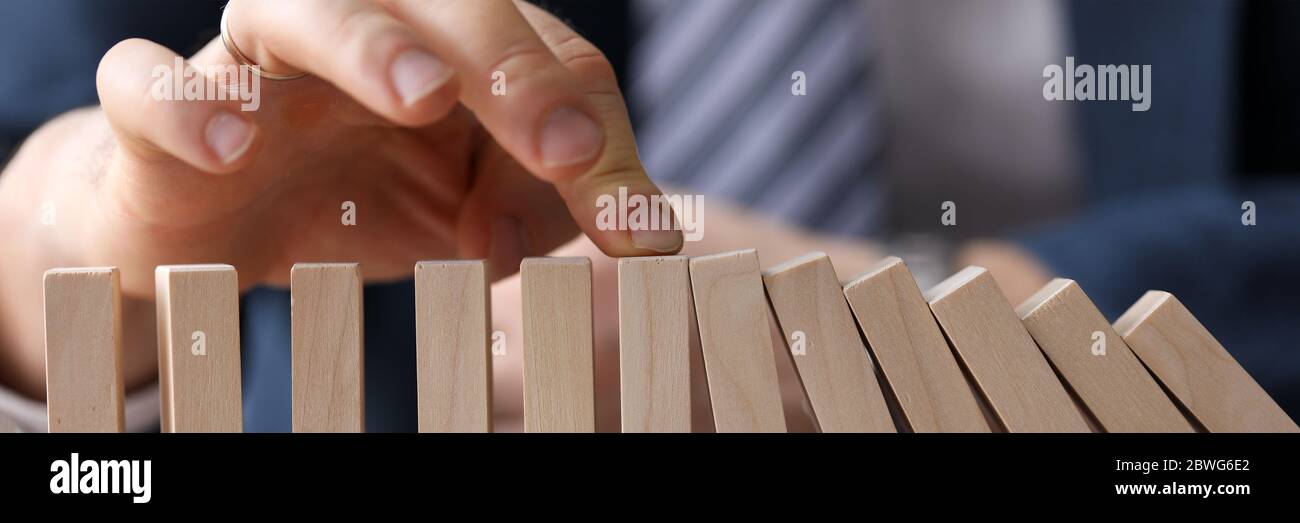 Construction vertical bars falls, man corrects Stock Photo - Alamy
