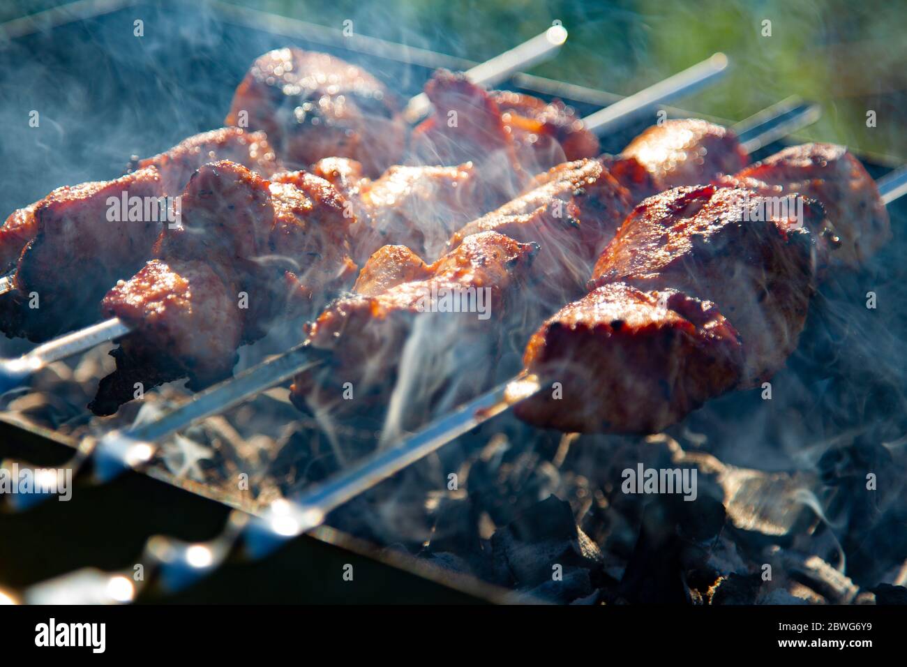 cooking juicy barbecue pork on the grill Stock Photo - Alamy