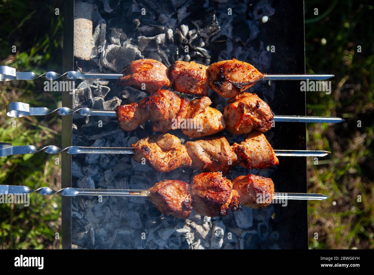 cooking juicy barbecue pork on the grill Stock Photo - Alamy