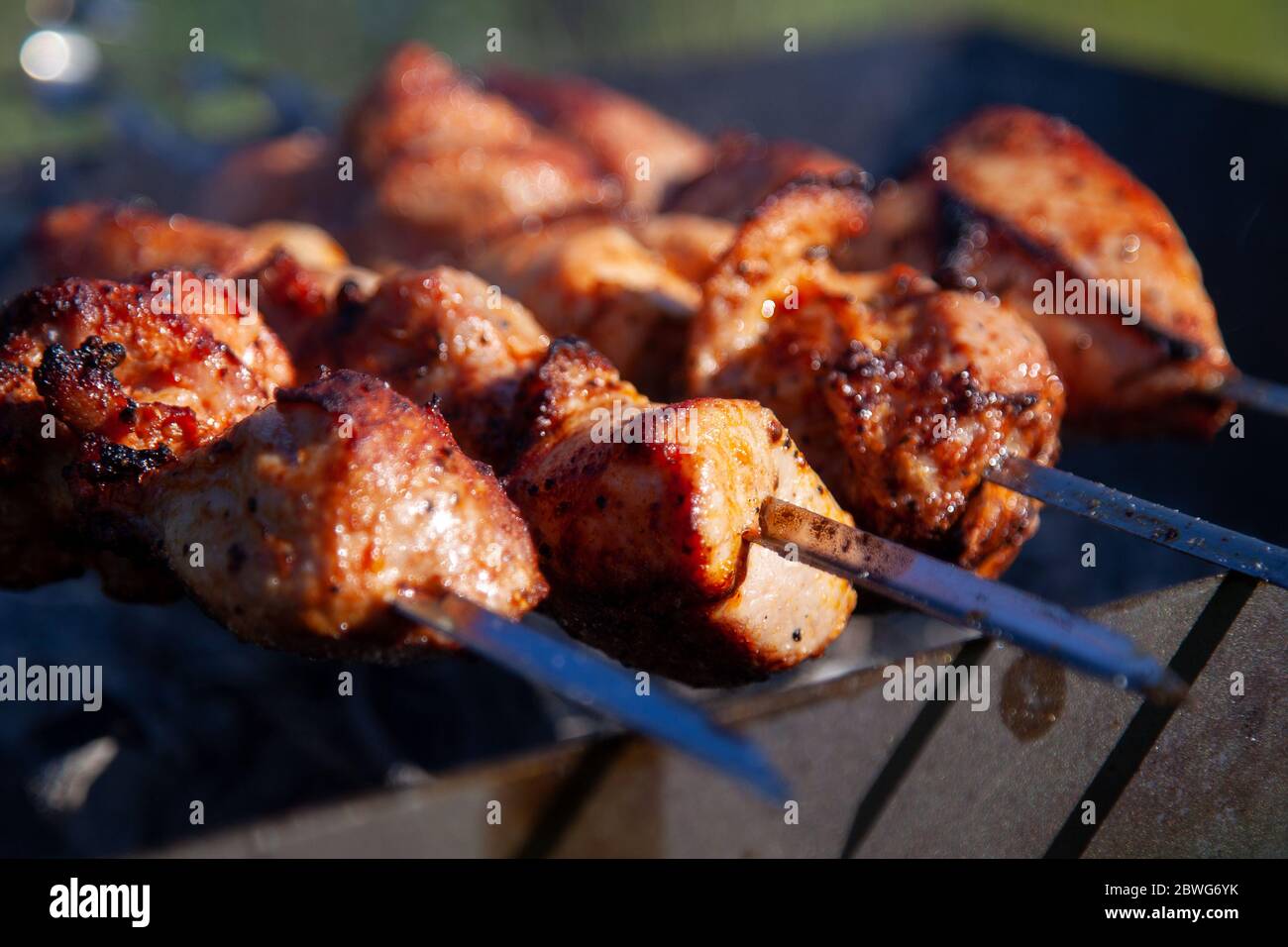cooking juicy barbecue pork on the grill Stock Photo - Alamy