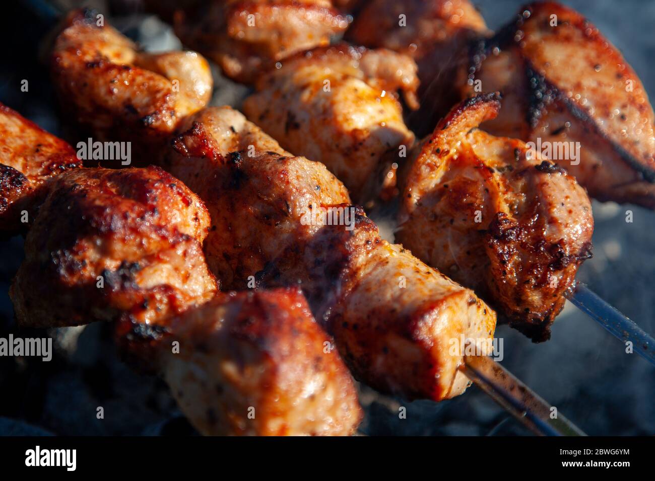 cooking juicy barbecue pork on the grill Stock Photo - Alamy