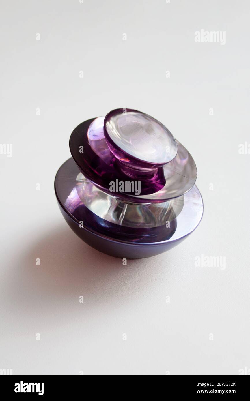 Dark purple glass perfume bottle isolated on white background Stock ...