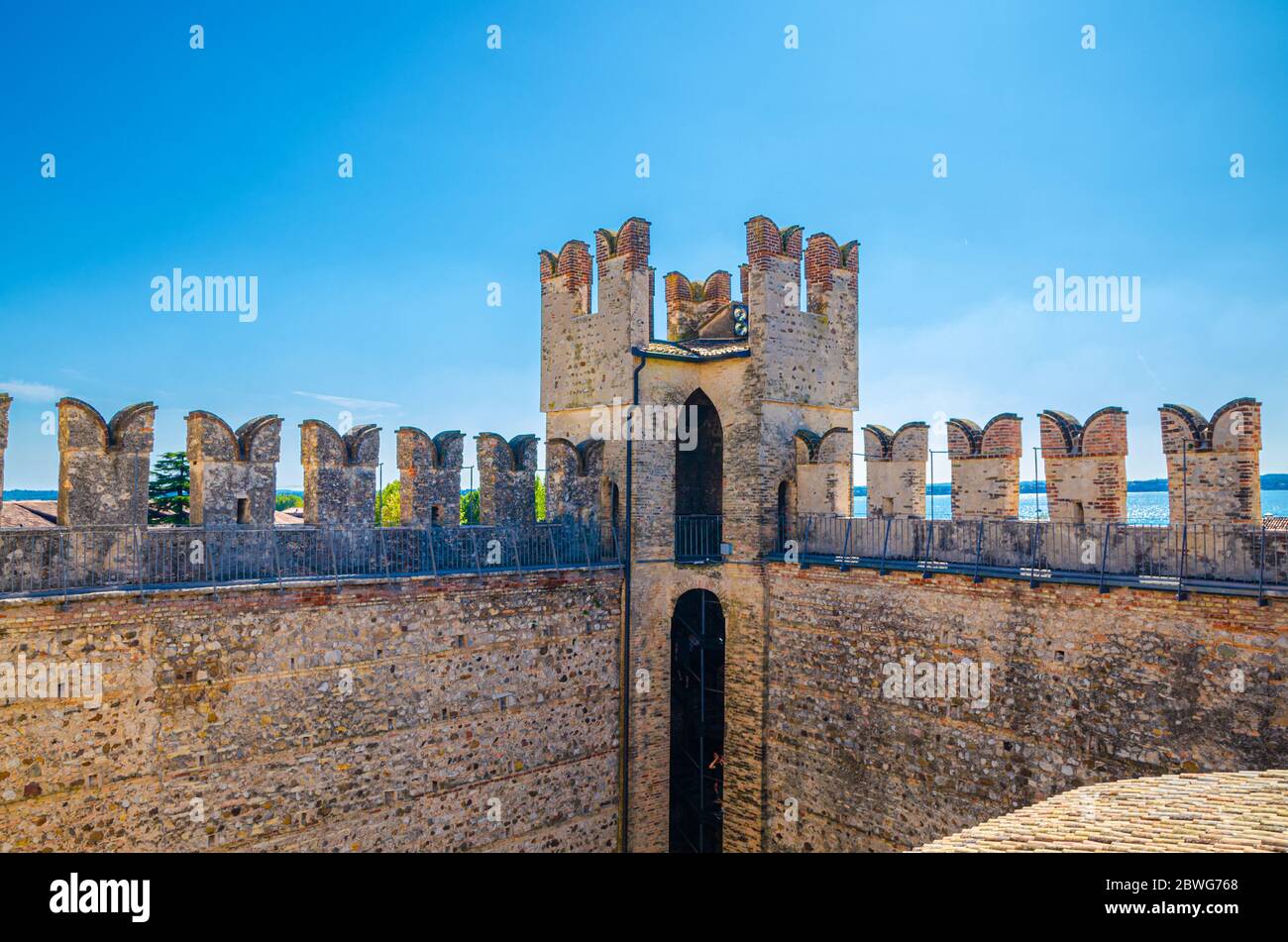 Sirmione, Italy, September 11, 2019: Tower and stone defense wall with ...