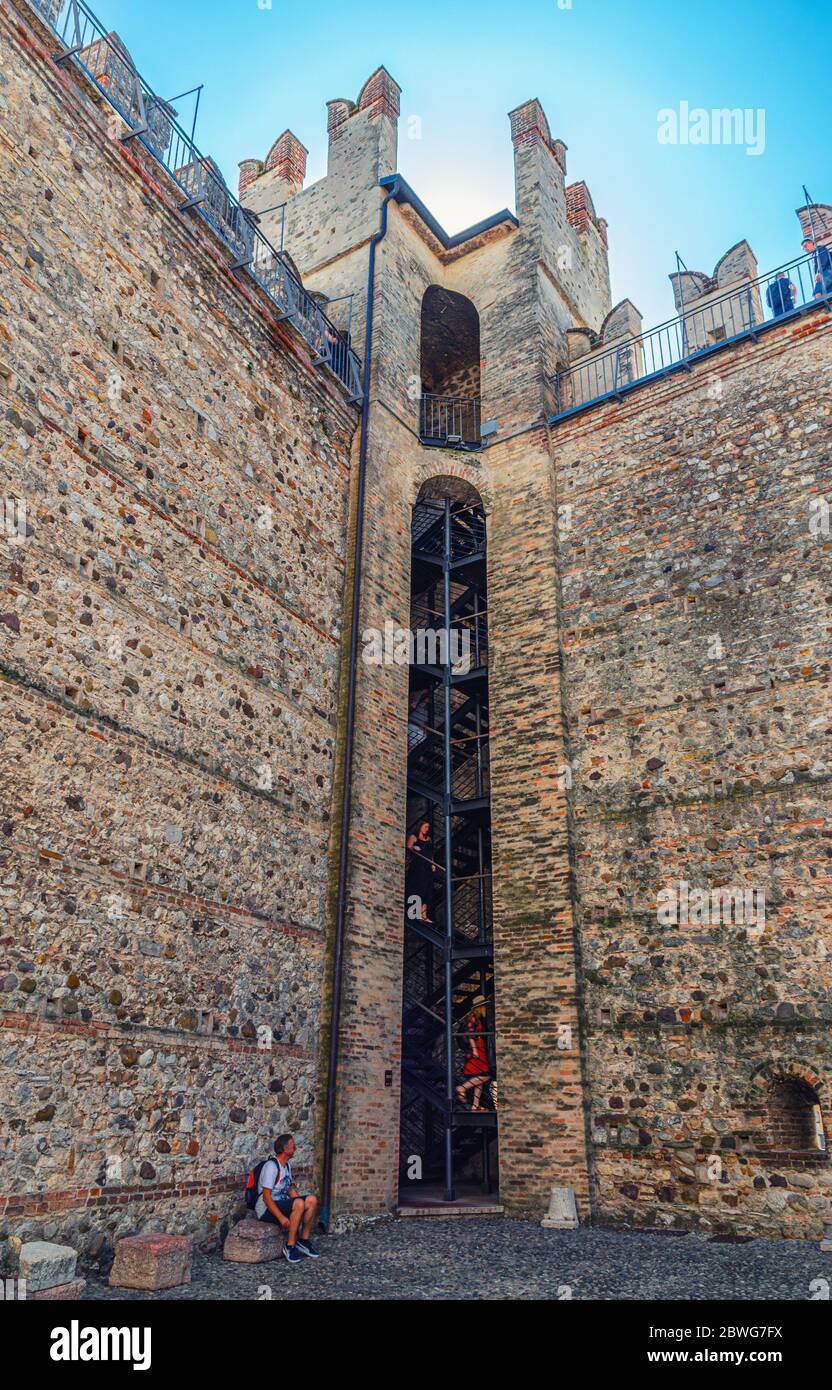 Sirmione, Italy, September 11, 2019: Tower and stone defense wall with ...