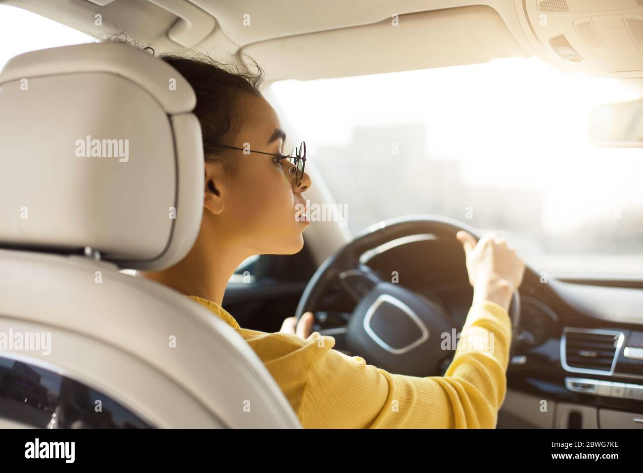 African Lady Driving Car Having Ride In City, Back View Stock Photo - Alamy